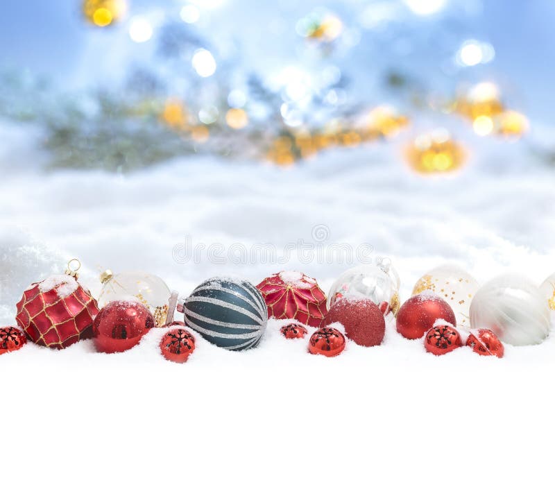 Many Christmas Balls in the Snow and Defocused Lights Stock Photo ...