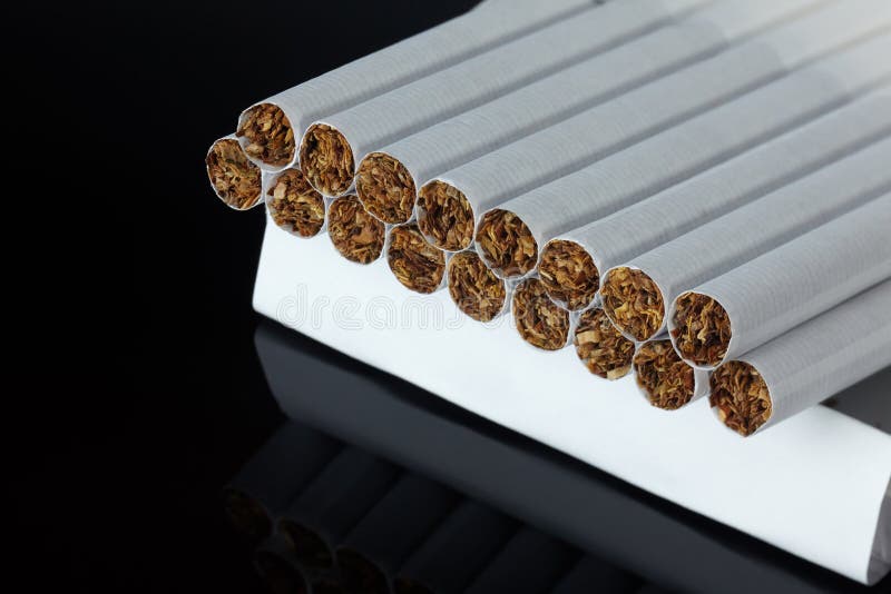 Many cigarettes in raw stock photo. Image of narcotic - 39877056