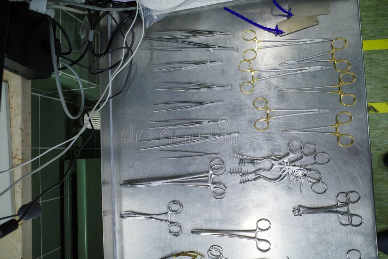 Many Cleaned Instruments for Performing Vascular Surgery Lie on a Metal ...