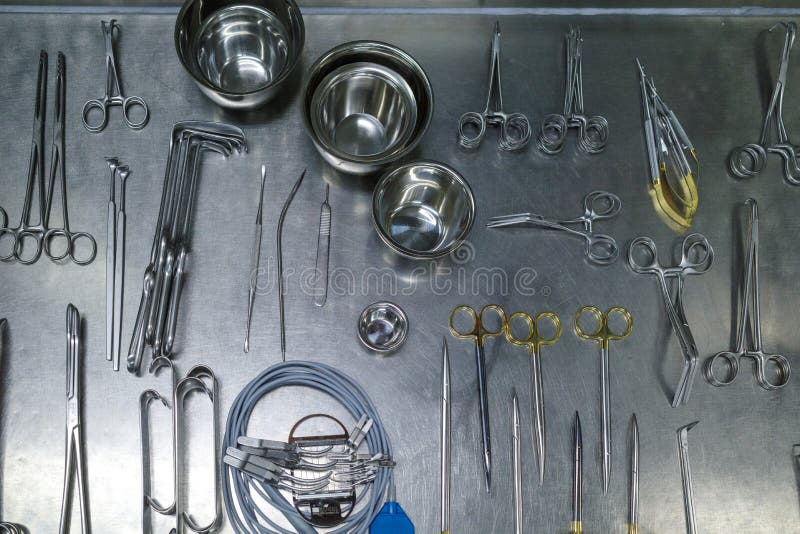 Many Cleaned Instruments for Performing Vascular Surgery Lie on a Metal ...