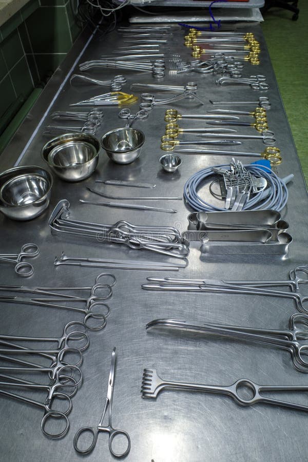 Many Cleaned Instruments for Performing Vascular Surgery Lie on a Metal ...