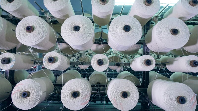 Many Clews in Rows Rotate on a Rack, Coiling Fiber. Stock Footage ...