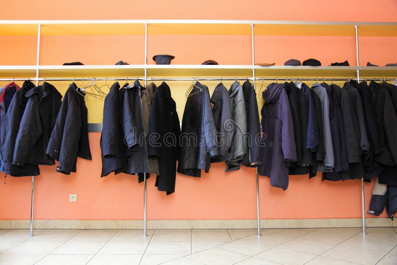 Many clothes in cloakroom stock photo. Image of jackets - 34080868