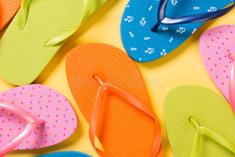 Many Colored Flip Flops on Yellow Background. Copy Space Top View Stock ...