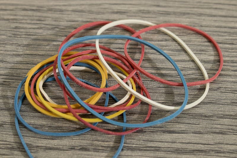 Many Colored Rubber Bands on a Wood Table Stock Image - Image of color ...