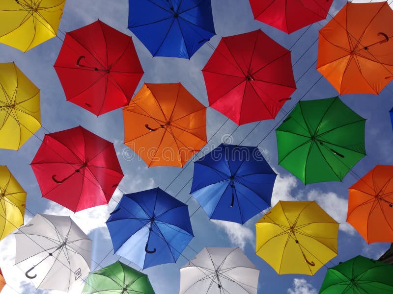 Many Colored Umbrellas on Blue Sky Background Stock Image - Image of ...