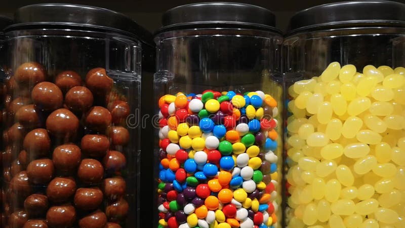 Many Colorful Candies - Different Types of Candy in a Jar Stock Video ...