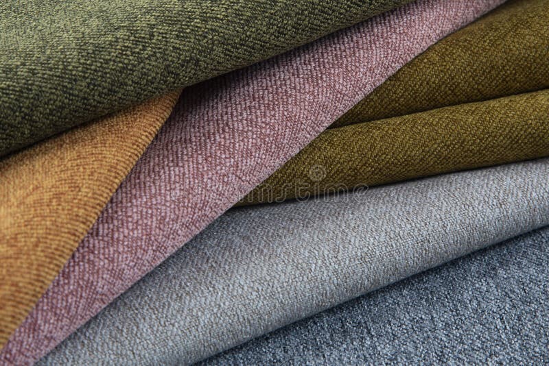Many Colorful Rolls of Fabric on a Plain Background Stock Photo - Image ...