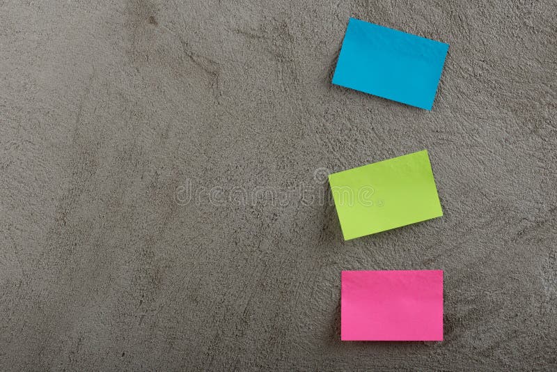 Many Colorful Sticky Note on Grey Cement Background. Copy Space Stock ...