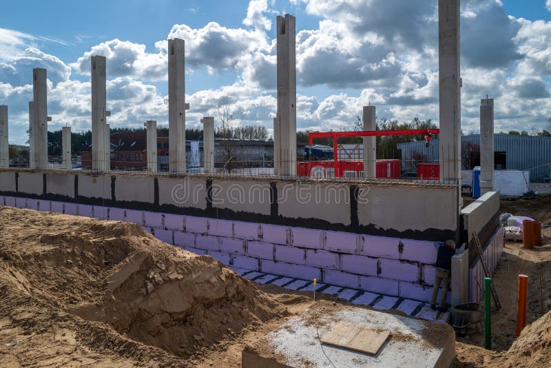 Concrete Pillars for a Factory Building are Erected on a Construction ...