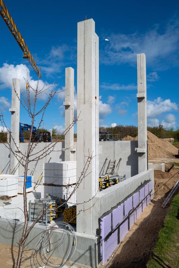 Concrete Pillars for a Factory Building are Erected on a Construction ...