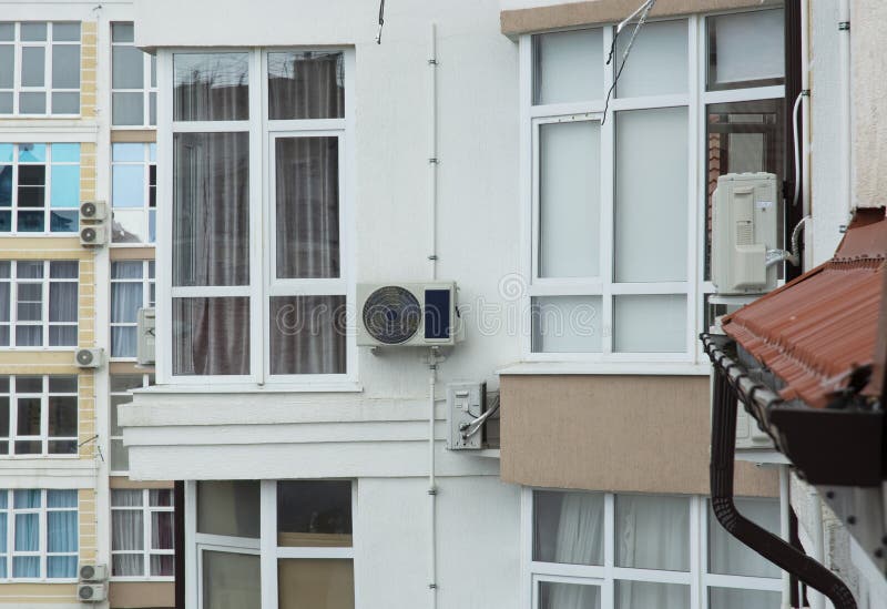 Many Cooling Fans from the Air Conditioner on the Wall of a Residential ...