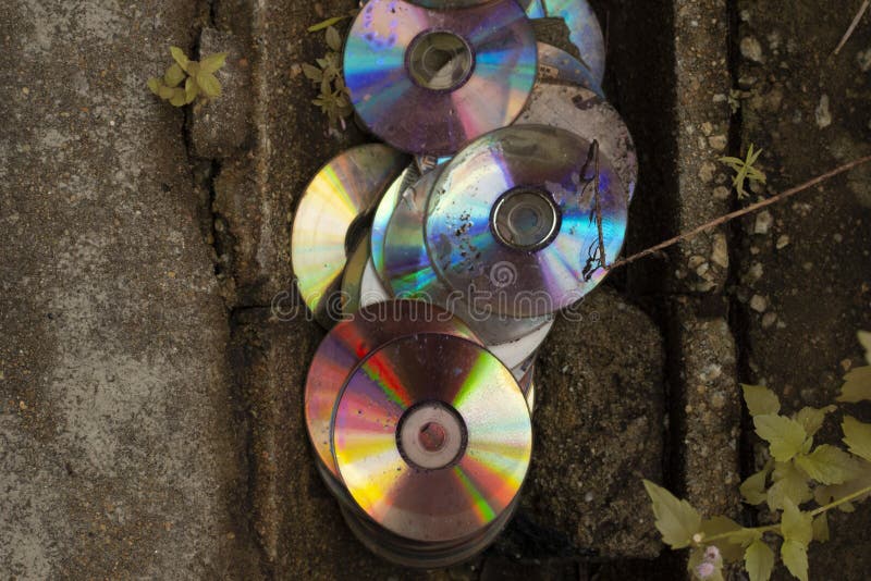 The Many Copies of Trash and Dirty Compact Disc in the Drain Stock ...