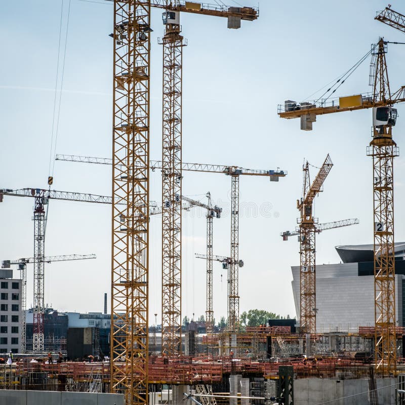 Many Cranes and Construction Workers on Construction Site Stock Image ...