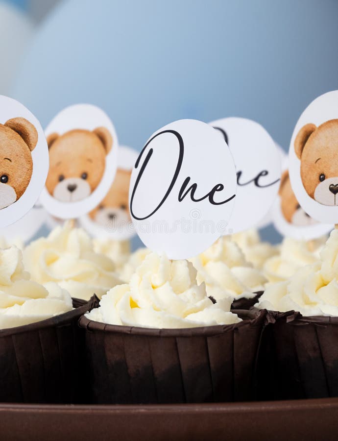 Many Cupcakes with White Cream and Toppers with Bears and Text One ...