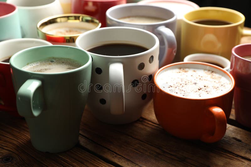 Many Cups of Different Coffees on Wooden Table, Closeup Stock Photo ...