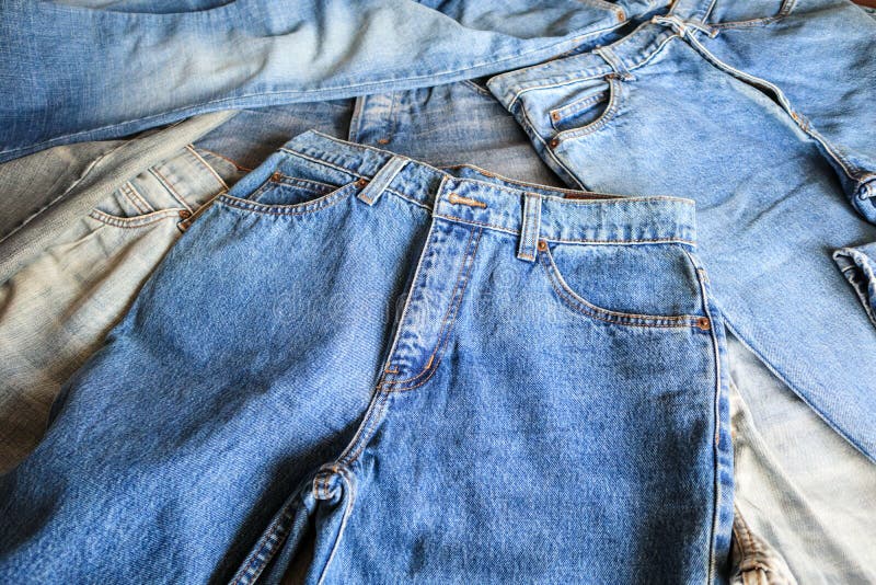 Many Denim Jeans Hanging on a Rack Stock Image - Image of denim, male ...