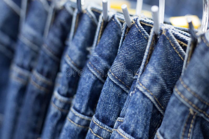 Many Denim Jeans Hanging on a Rack Stock Image - Image of denim, male ...