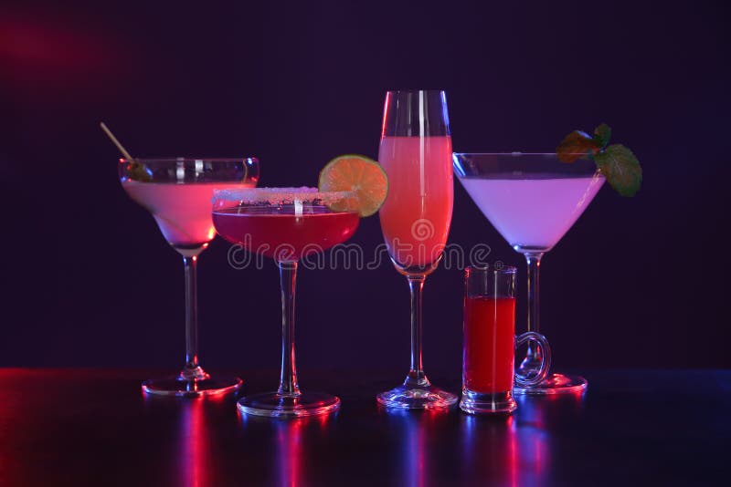 Many Different Alcoholic Drinks on Table Against Dark Background Stock ...