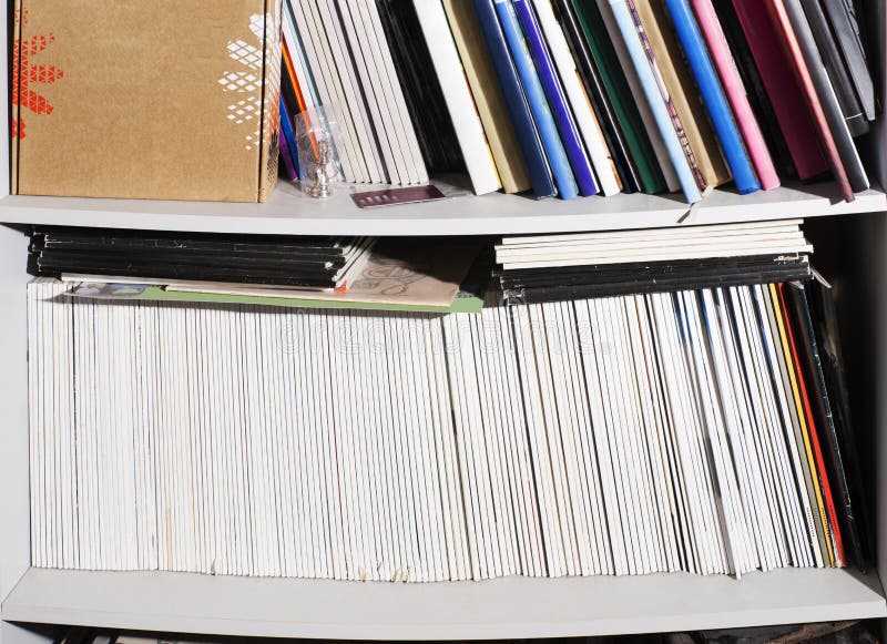 Many Different Books on the Shelves, in an Open Cupboard Stock Photo ...