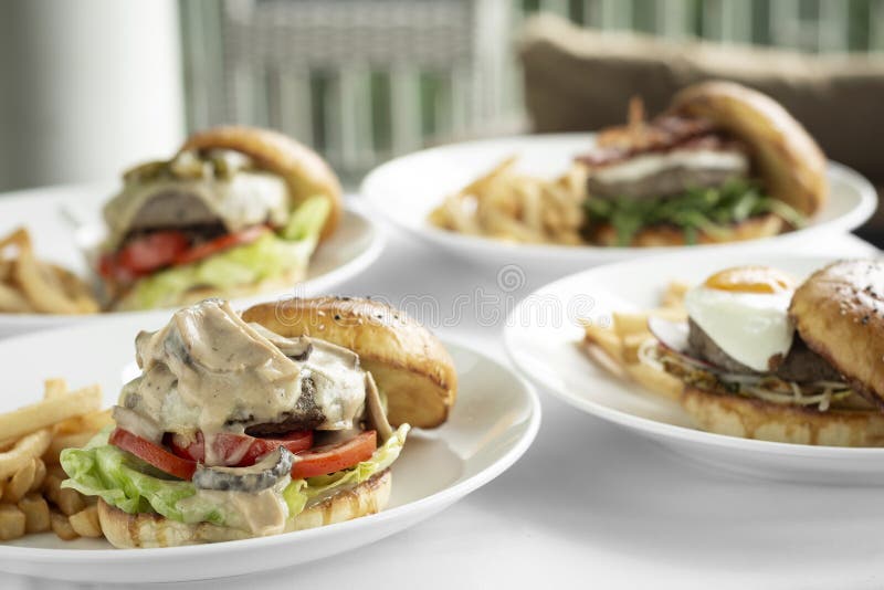 Selection of Many Different Burgers on Restaurant Table Stock Image ...