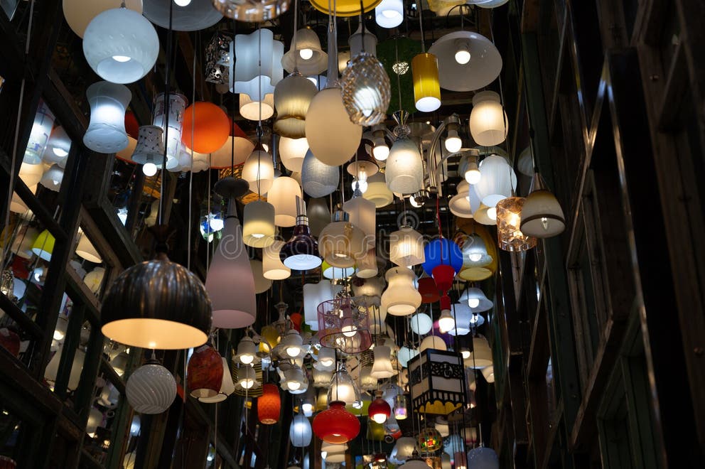 Many Different Ceiling Lamps with Lightbulbs in Dark Room with Mirrors ...