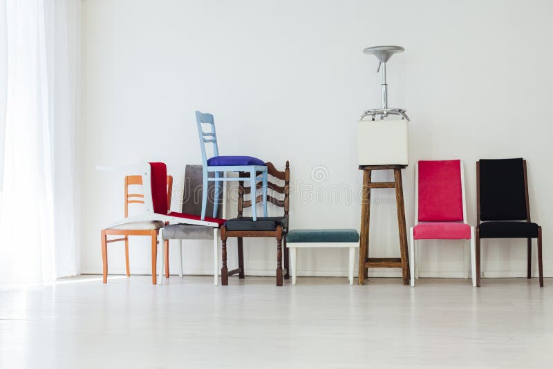 Many Different Chairs Stand in the White Room Stock Photo - Image of ...