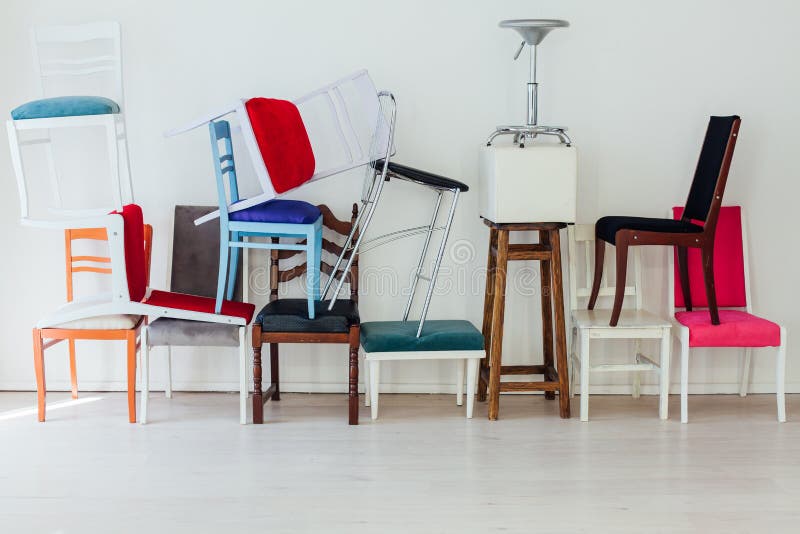 Many Different Chairs Stand in the White Room Stock Photo - Image of ...