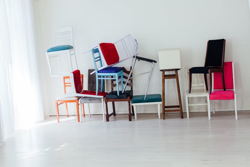 Many Different Chairs Stand in the White Room Stock Photo - Image of ...