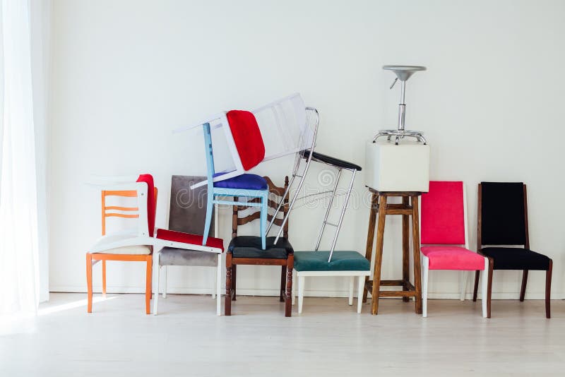 Many Different Chairs Stand in the White Room Stock Photo - Image of ...
