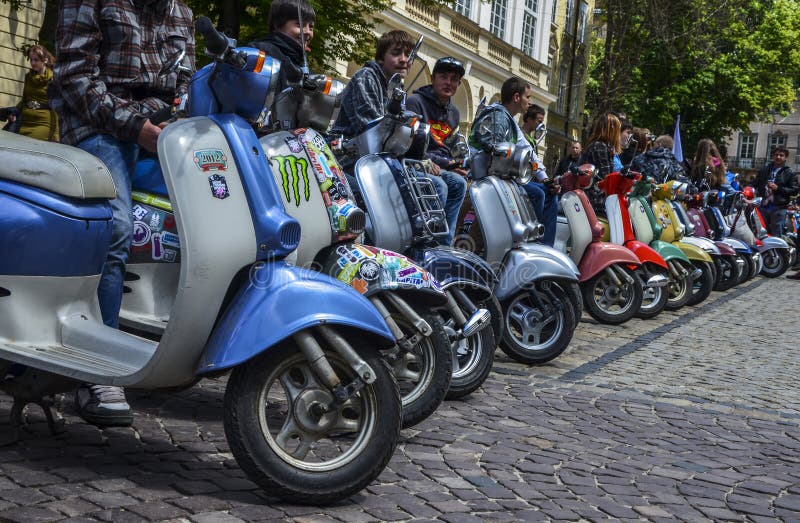 Many Different Colorful Motor Scooters Parked in the Street Editorial ...