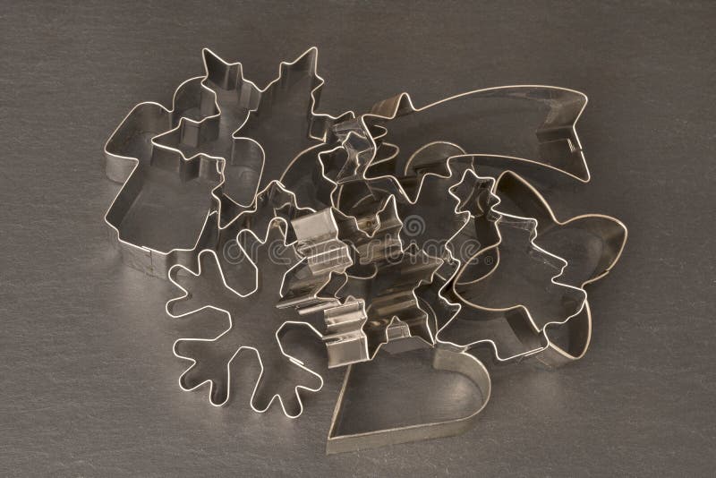 Cookie Cutter on Slate Plate Stock Image - Image of shiny, light: 46963655