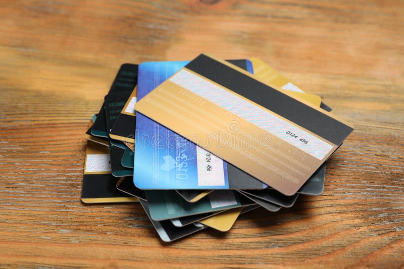 Different Credit Cards, Tablet and Stationery on Wooden Table, Flat Lay ...