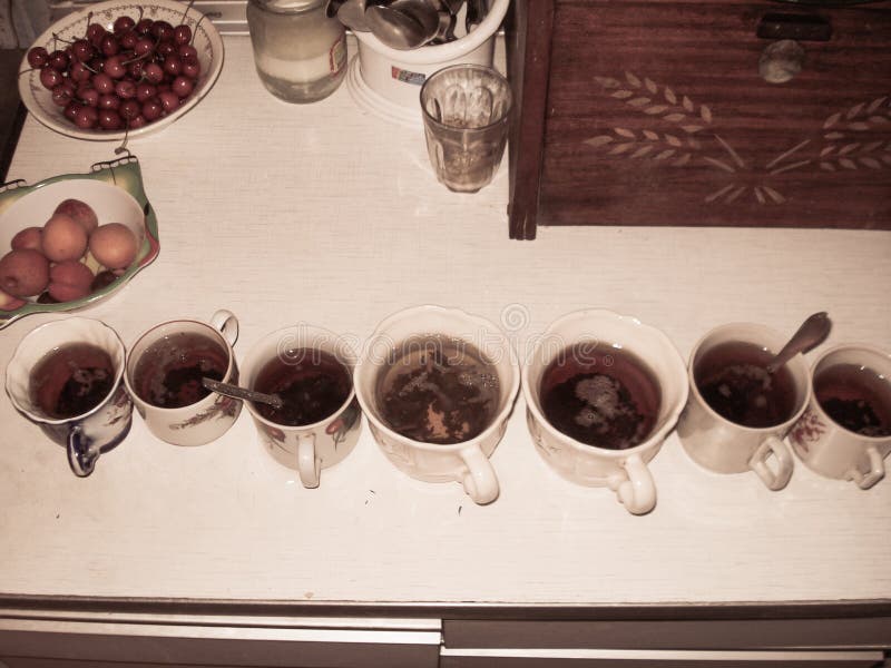 Many Different Cups of Tea are on the Table in a Row. Retro Style Stock ...