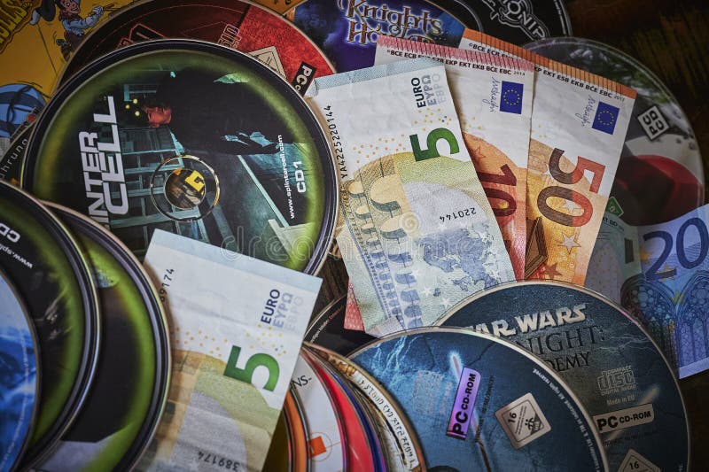 Many Different Discs of Computer Games Mixed with Euro Bank Notes ...