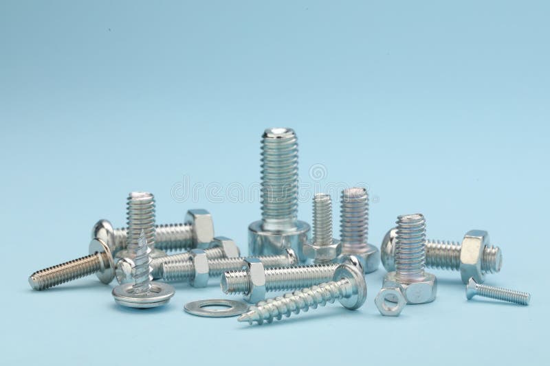 Many Different Fasteners on Light Blue Background, Closeup Stock Photo ...