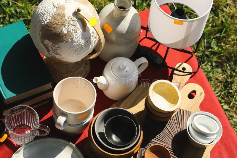 Many Different Items on Table Outdoors, Above View. Garage Sale Stock ...