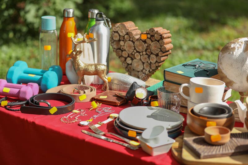 Many Different Items on Table Outdoors. Garage Sale Stock Image - Image ...