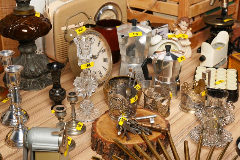 Many Different Items on Wooden Table. Garage Sale Stock Image - Image ...