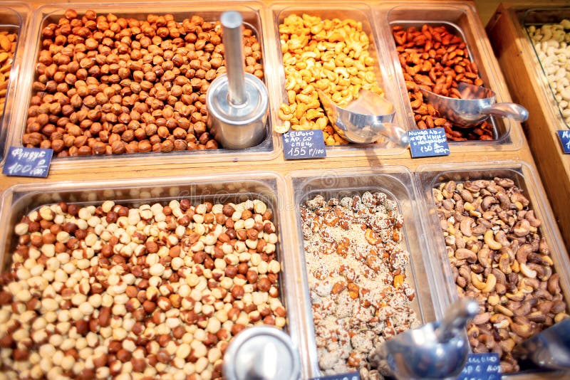 Many Different Nuts are Sold on the Counter in the Store Stock Photo ...