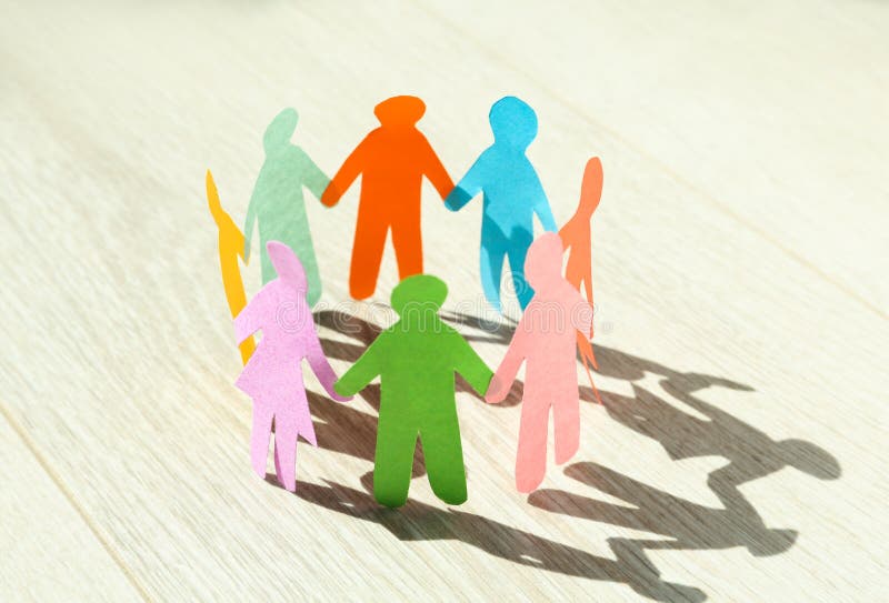 Many Different Paper Human Figures Standing in Circle on White Wooden ...