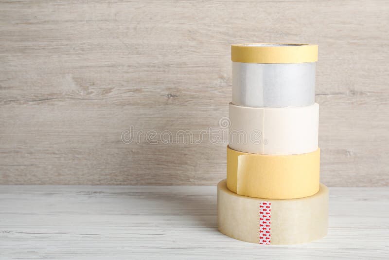 Many Different Rolls of Adhesive Tape on Wooden Table. Space for Text ...