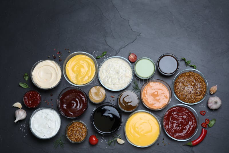 Many Different Sauces on Black Table, Flat Lay Stock Photo - Image of ...