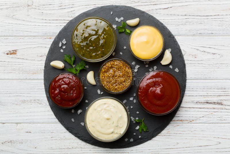 Many Different Sauces and Herbs on Table, Flat Lay Top View. Sauces on ...