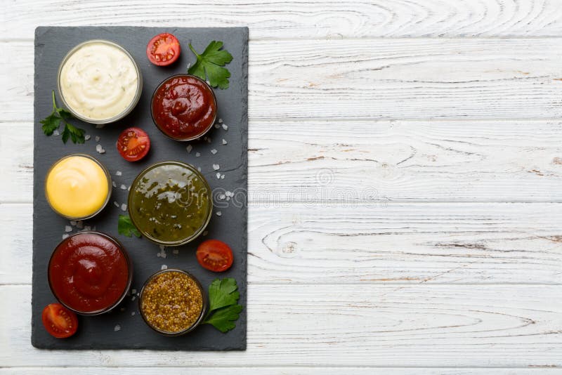 Many Different Sauces and Herbs on Table, Flat Lay Top View. Sauces on ...