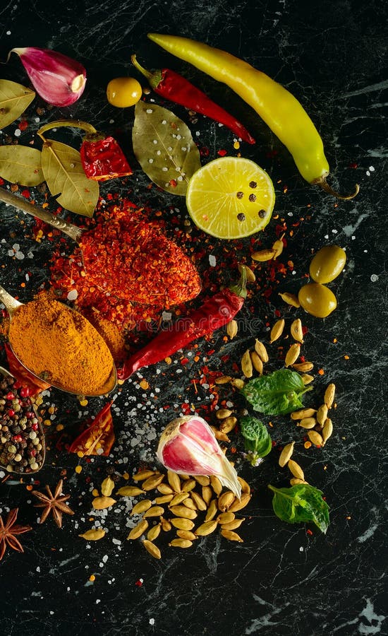 Different Spices and Aromatic Herbs on a Dark Table. Vertical Photo ...