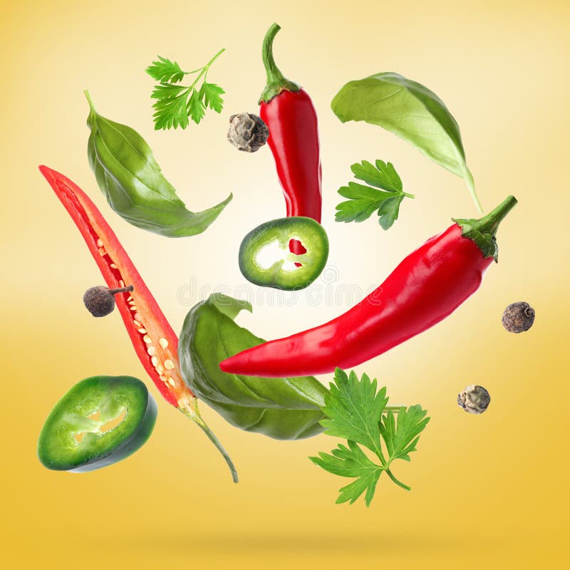 Many Different Spices Falling on Pale Yellow Background Stock Photo ...