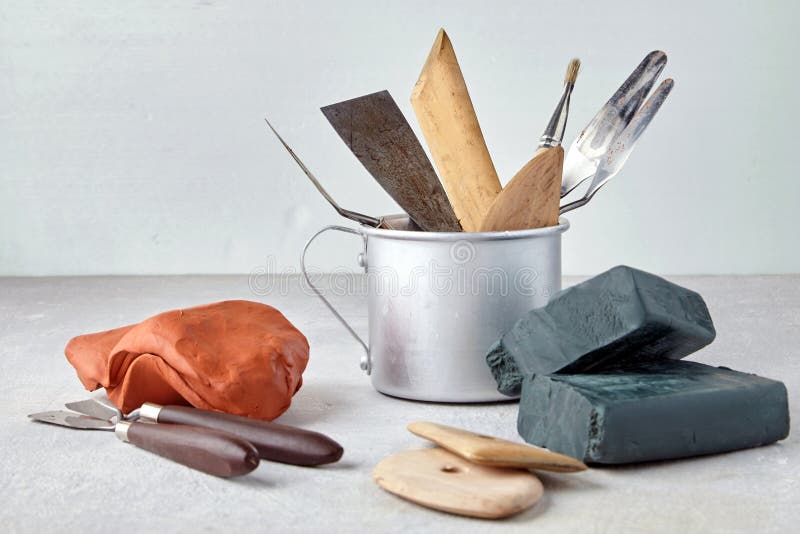 Many Different Tools and Pieces of Orange Clay and Green Plasticine in ...