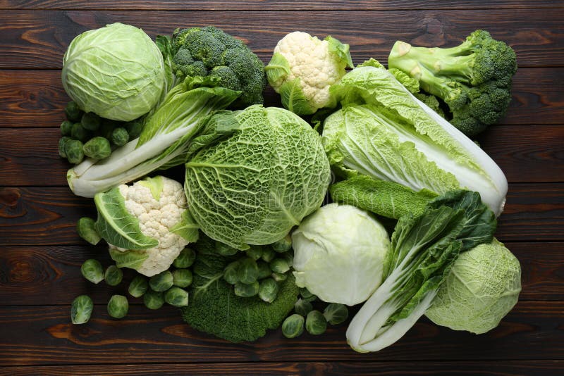 Many Different Types of Fresh Cabbage on Wooden Table, Flat Lay Stock ...