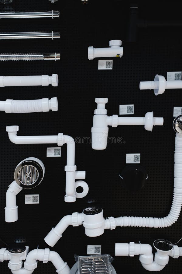 Many Different White Plastic Bath Drain Systems on Store Display Stock ...